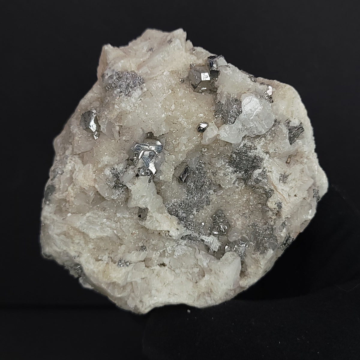 Carrollite in Calcite and Feldspar.